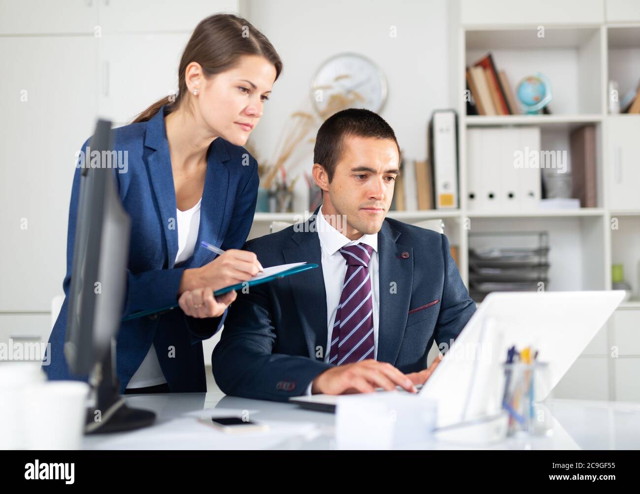 Directors assistant makes daily routine and writes down instructions ...
