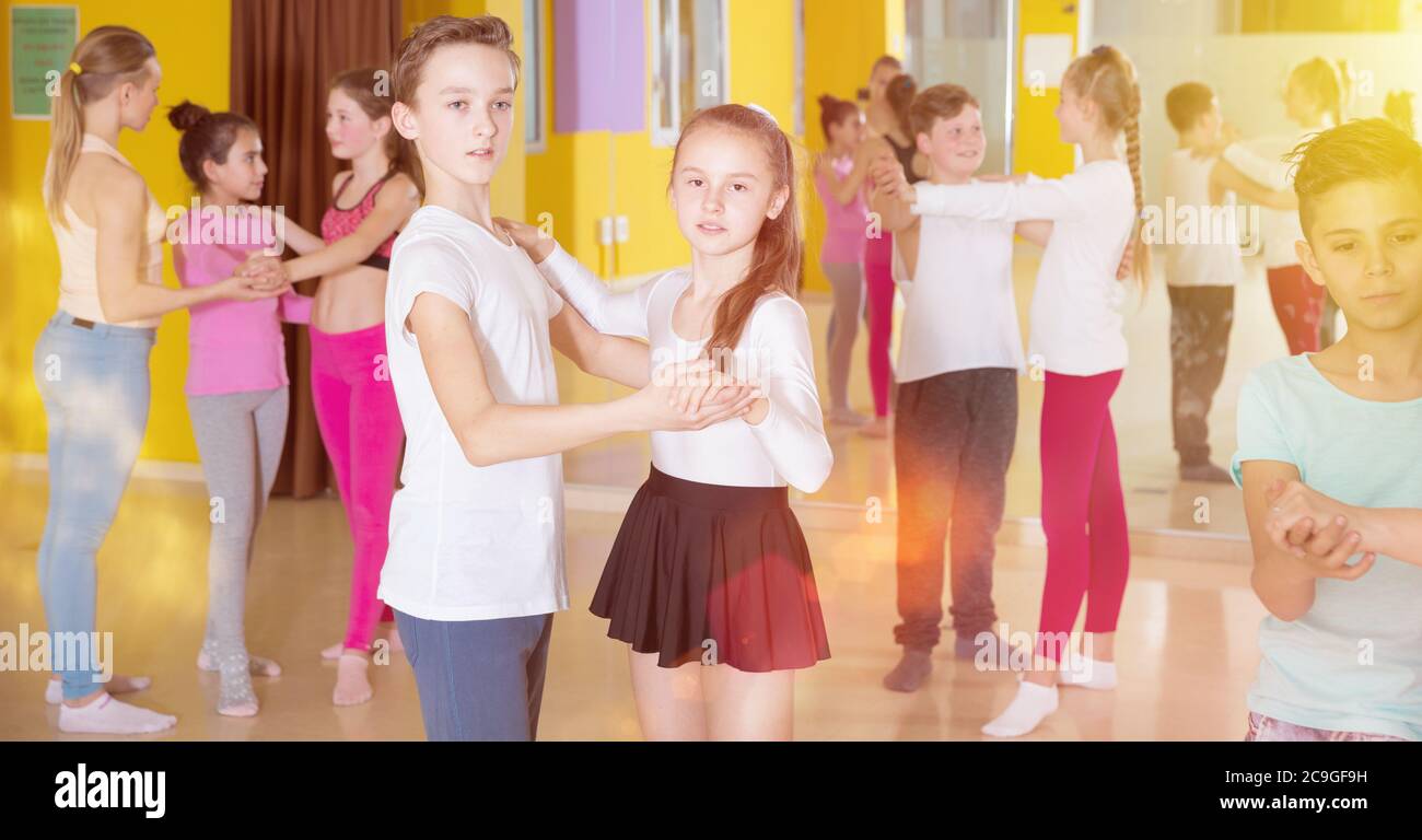 Children dancing together slow ballroom dances in pairs in choreography ...