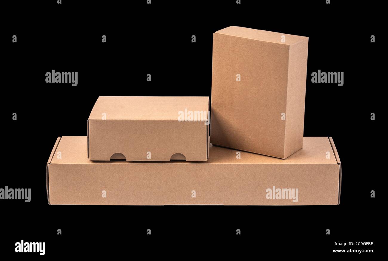 closing a stack of cardboard boxes on a black background with clipping ...