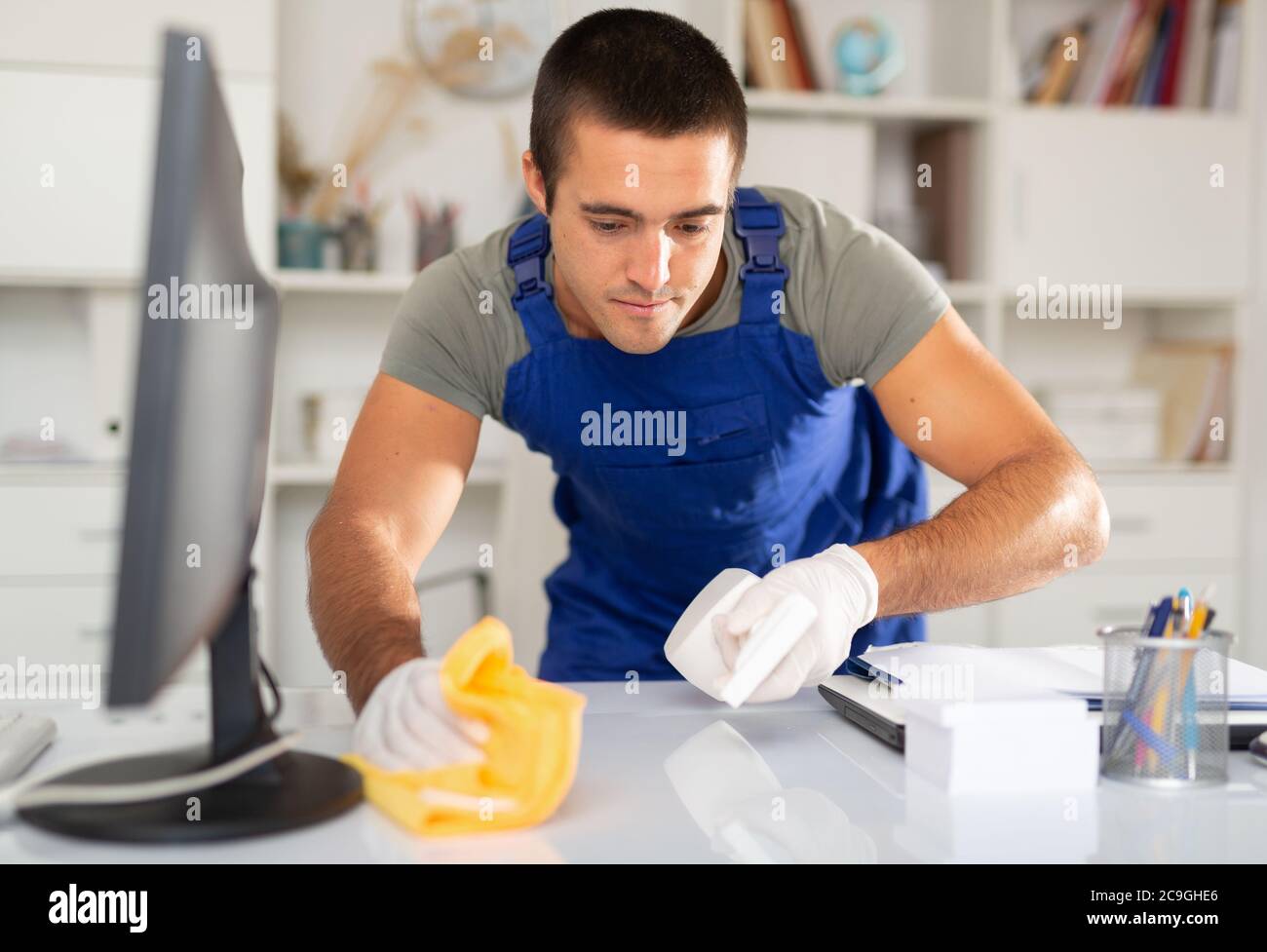 Positive professional spanish cleaner cleaning hi-res stock photography ...