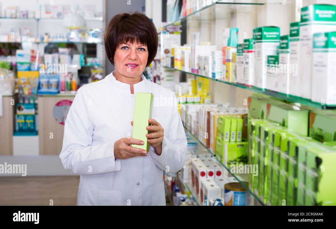 portrait of woman pharmacist wearing uniform and working in ...