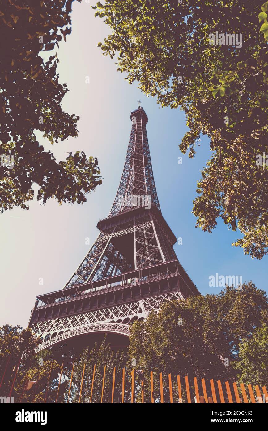 Green trees surrounding world famous Eiffel tower in Paris, France ...