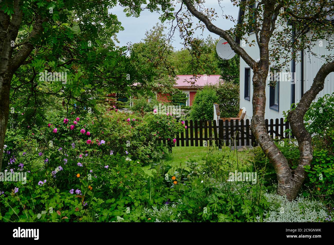 Architectural details and lush garden scenery in west Kópavogur, 50s ...