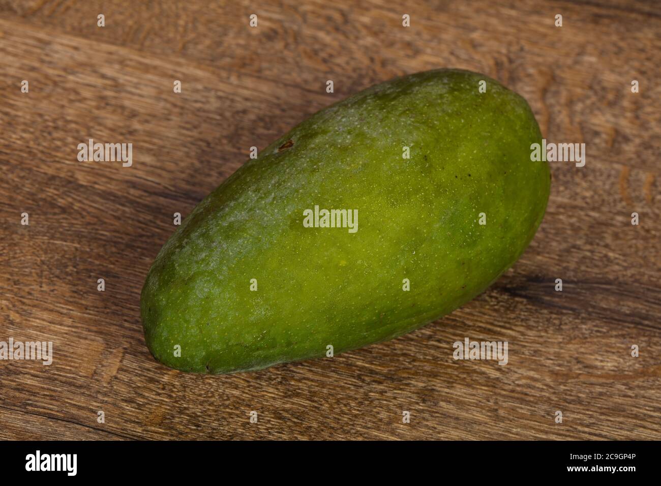 Green tasty mango over background Stock Photo - Alamy