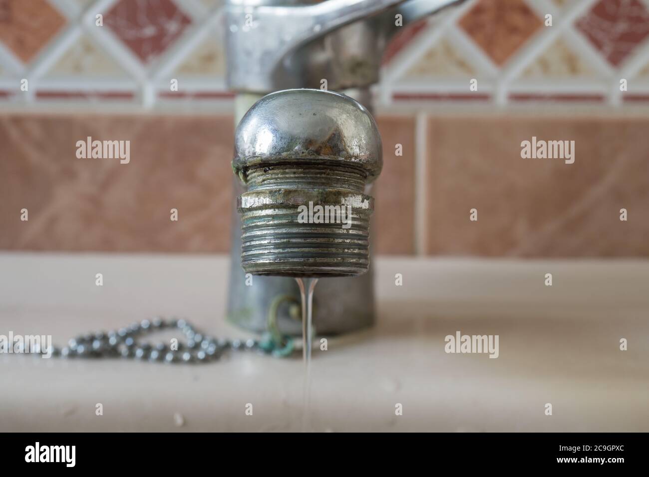 Water tap close-up with limescale soiled calcified faucet water flowing ...