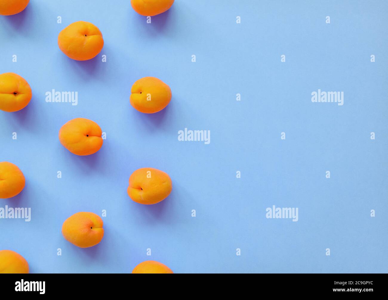 Apricot on light blue background. Apricot pattern. Top view, flat lay ...