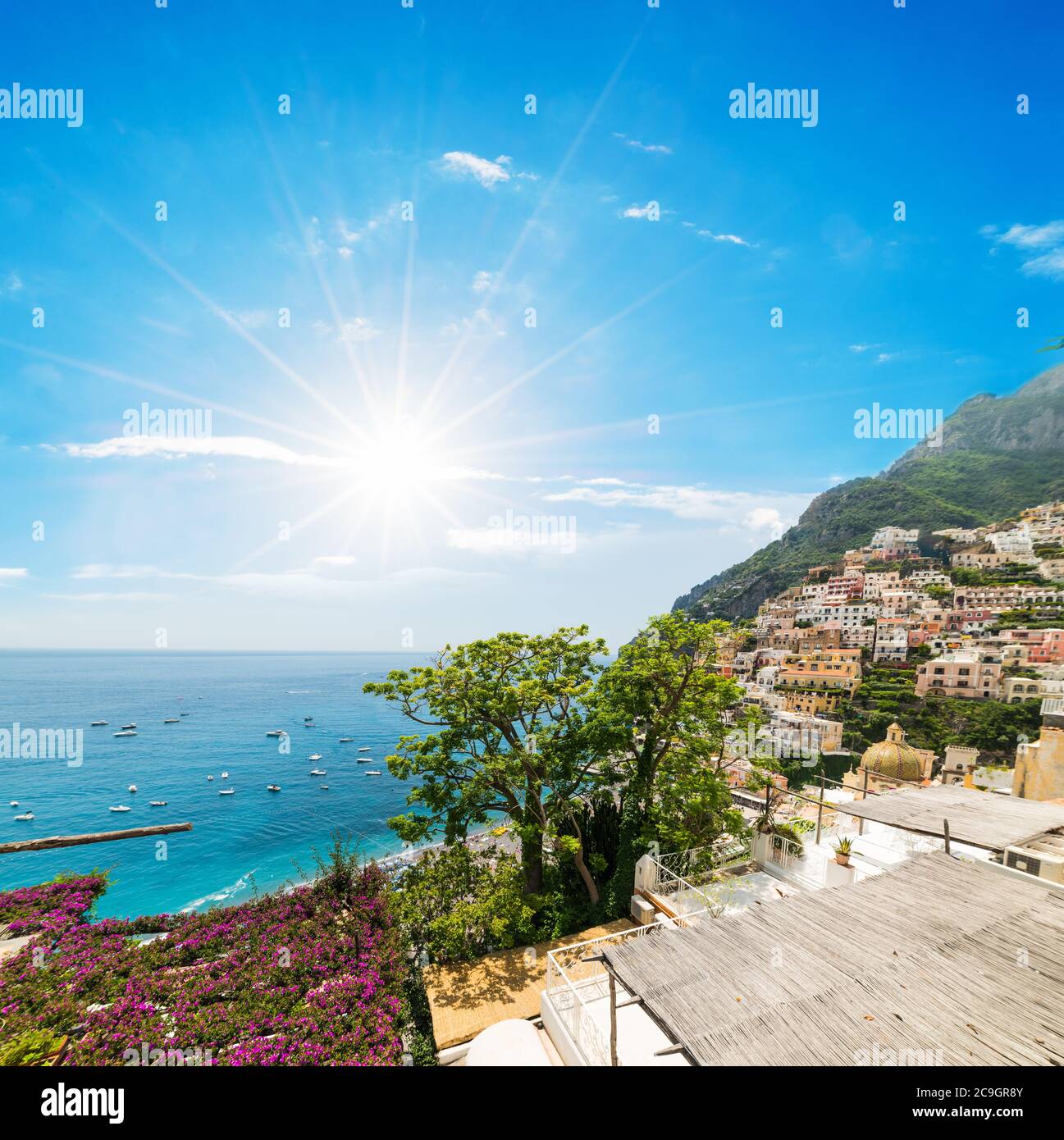 Sun shining over Positano on a springtime day. Amalfi coast, Italy ...