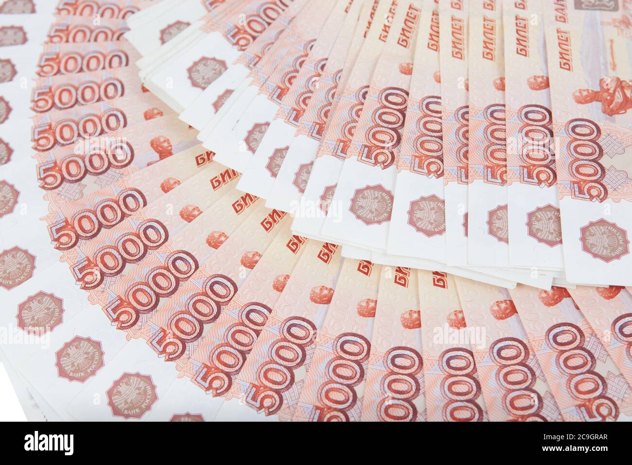 A bundle of banknotes of five thousand rubles on a white background ...