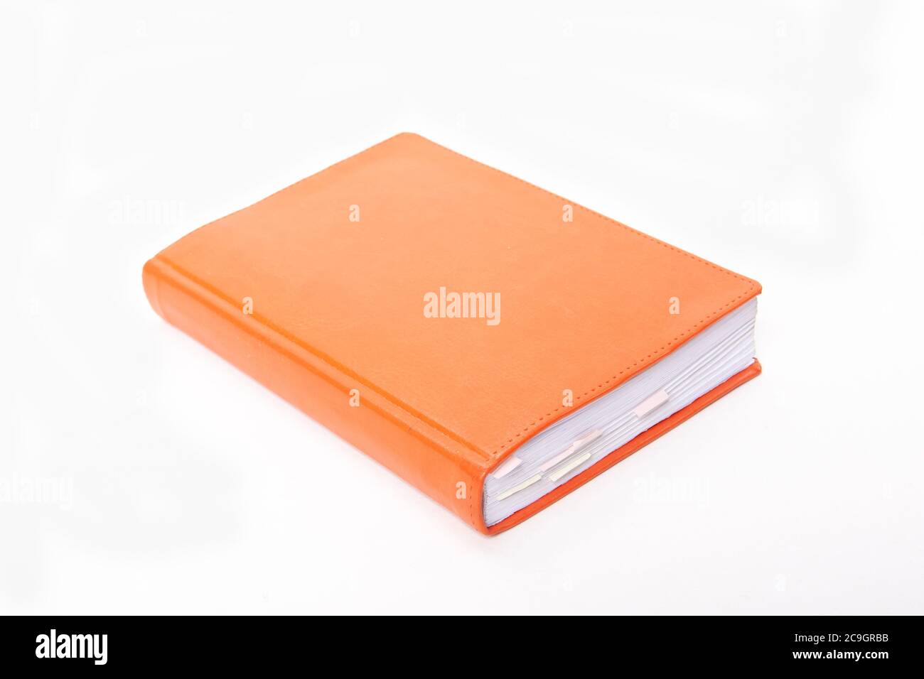 Orange notepad with bookmarks on white background Stock Photo - Alamy