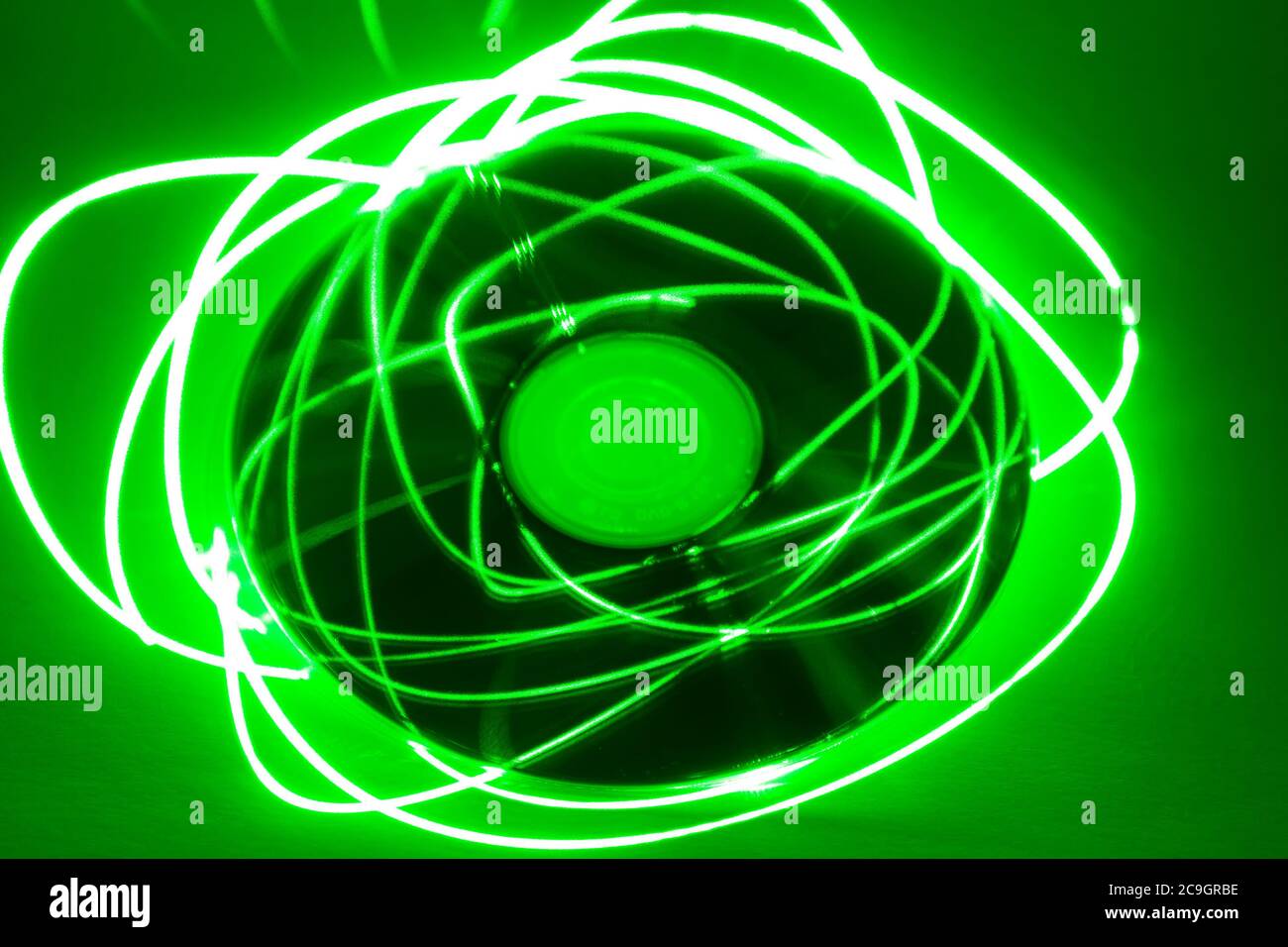 Compact disk under green laser beam Stock Photo - Alamy