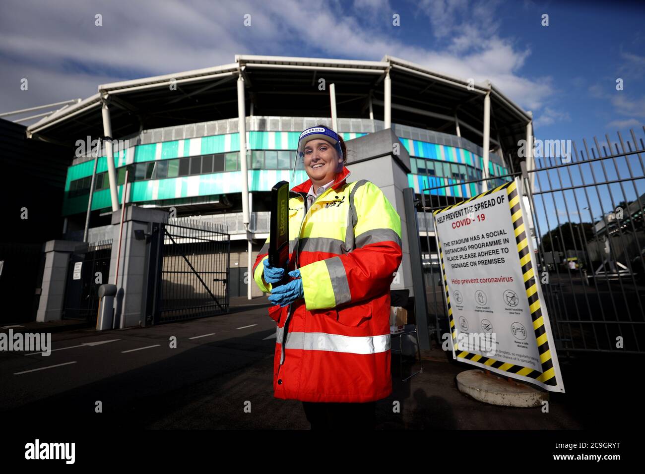 A general view of a member of security staff wearing PPE outside the ...