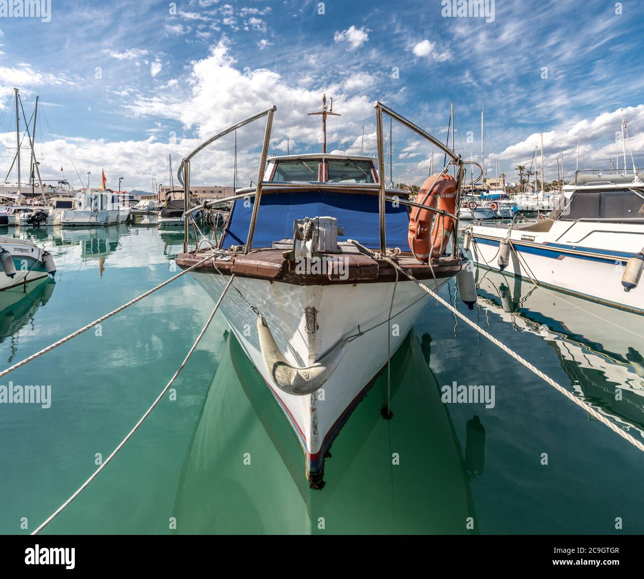 bow of a boat old and ruined, docked at a harbor pier, wide angle Stock ...