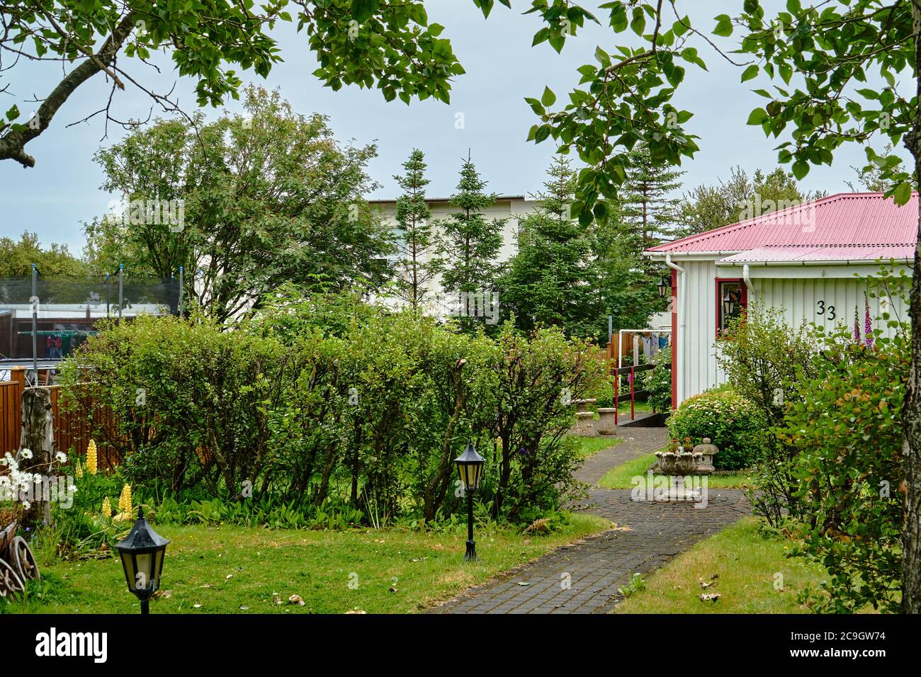 Architectural details and lush garden scenery in west Kópavogur, 50s ...