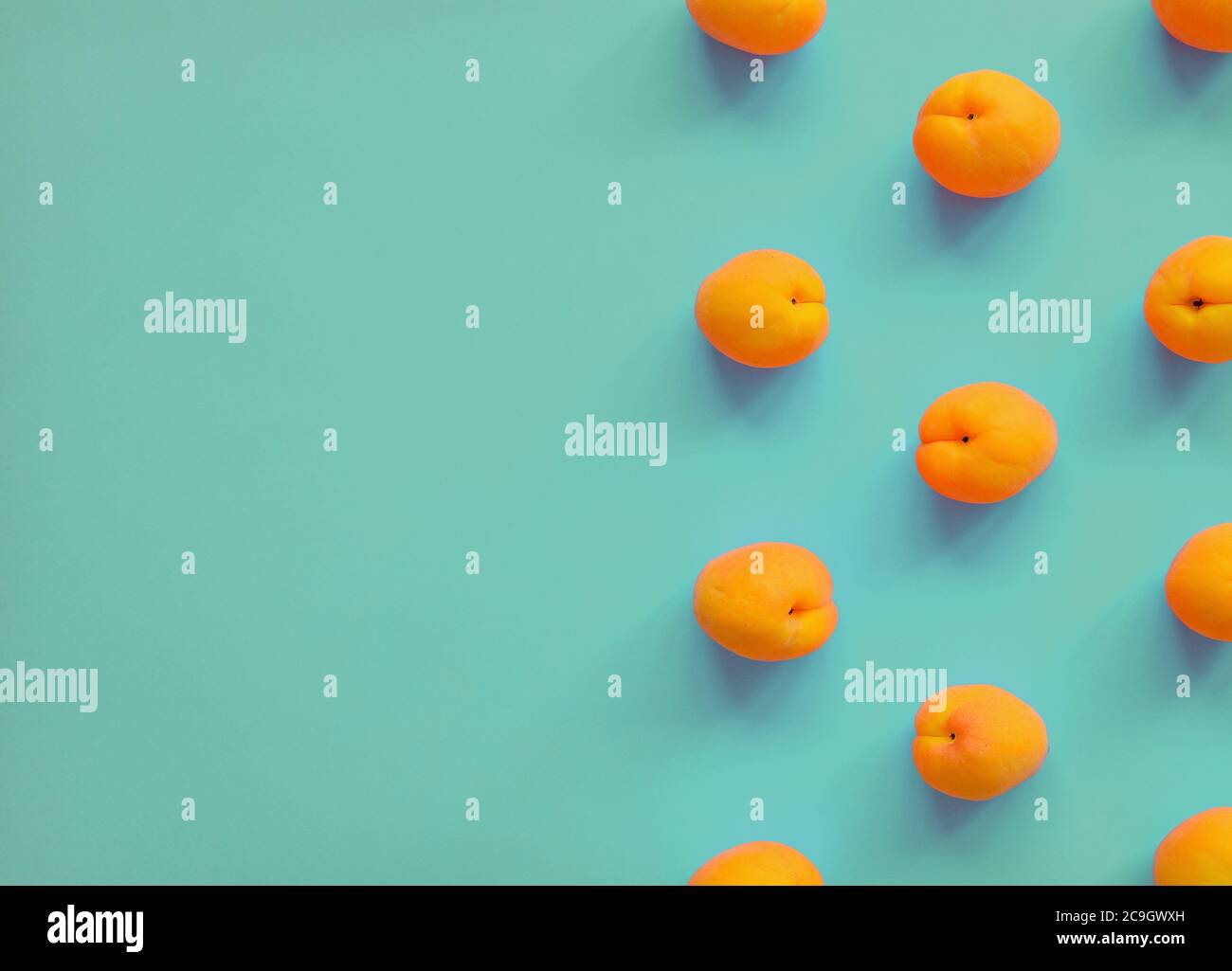 Apricot on turquoise background. Apricot pattern. Top view, flat lay ...