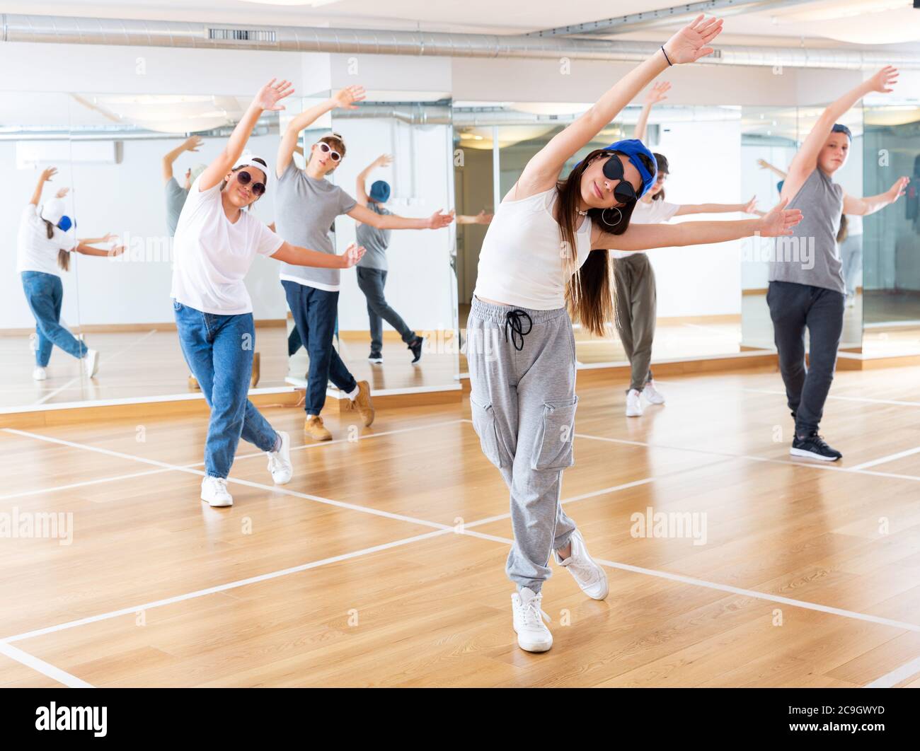 Joyous boy and girls dancing hip hop at lesson in the dance class Stock ...
