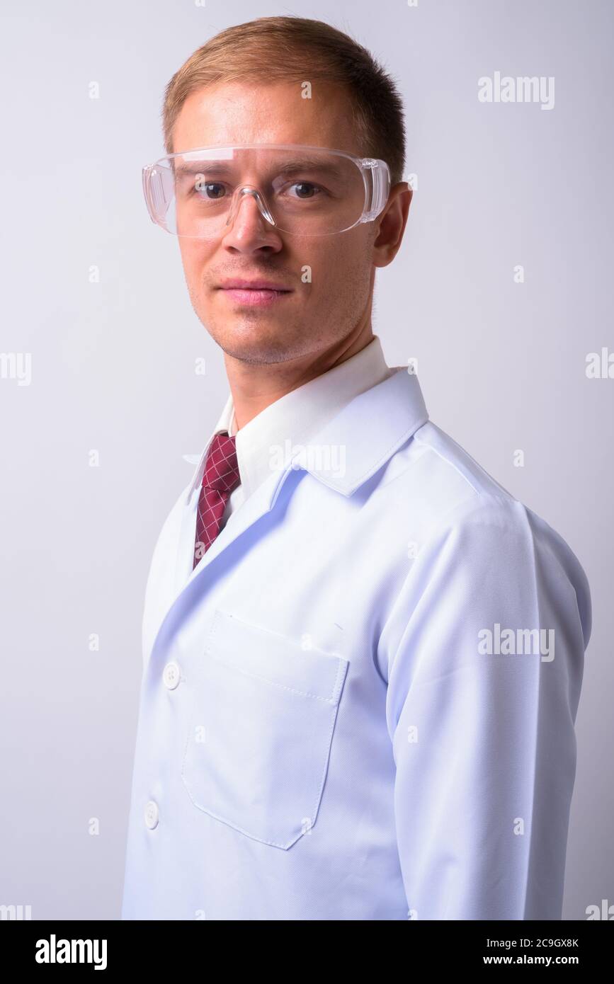 Portrait of handsome man doctor as scientist Stock Photo - Alamy