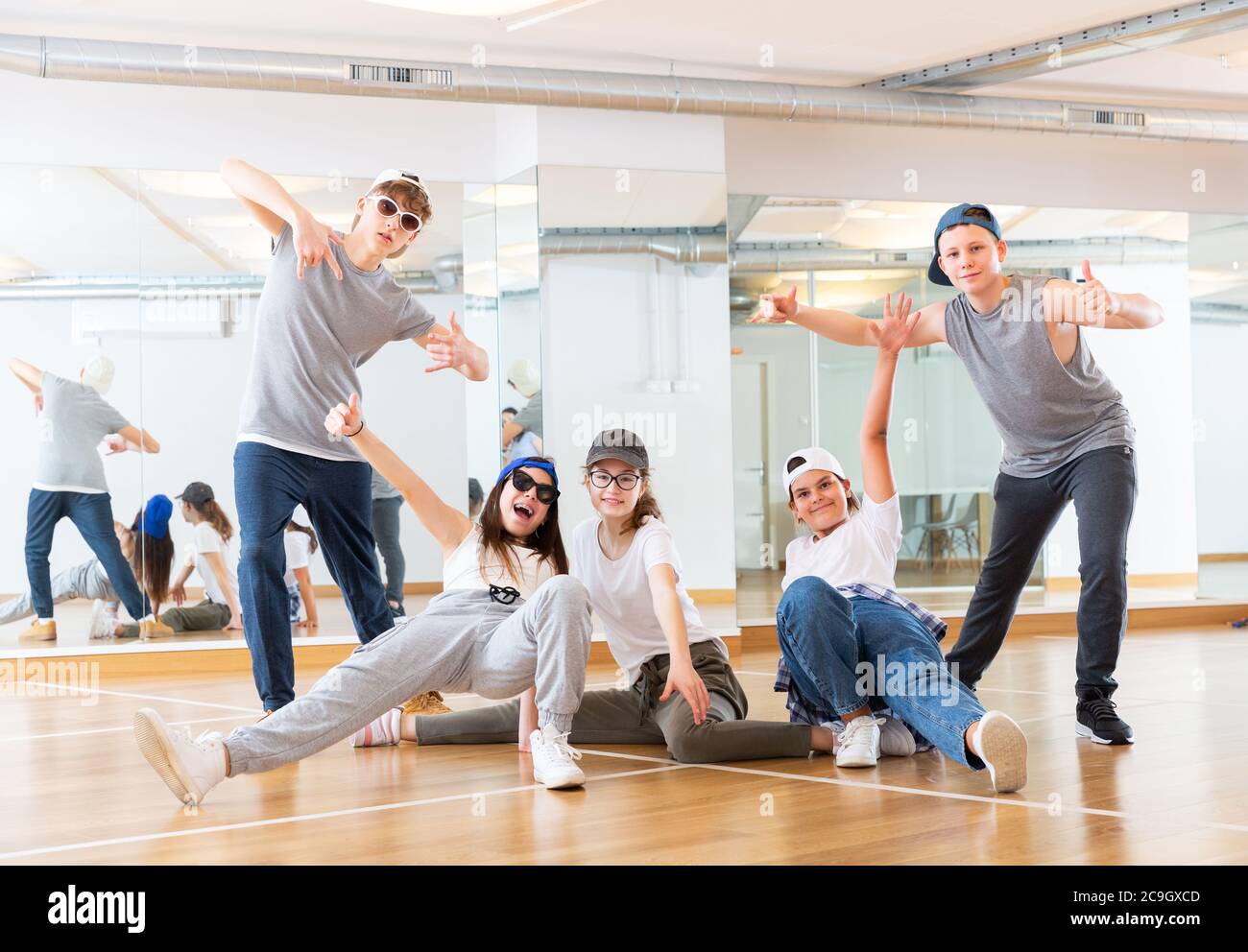 Group four teenagers in studio hi-res stock photography and images - Alamy