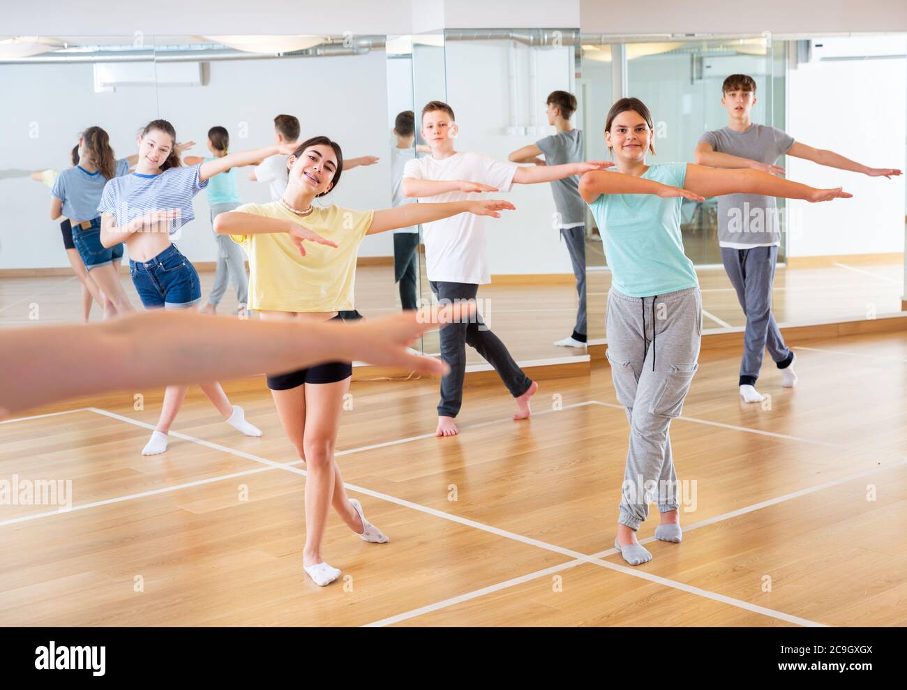 Dancing group of five teenagers practicing new dance in studio Stock ...
