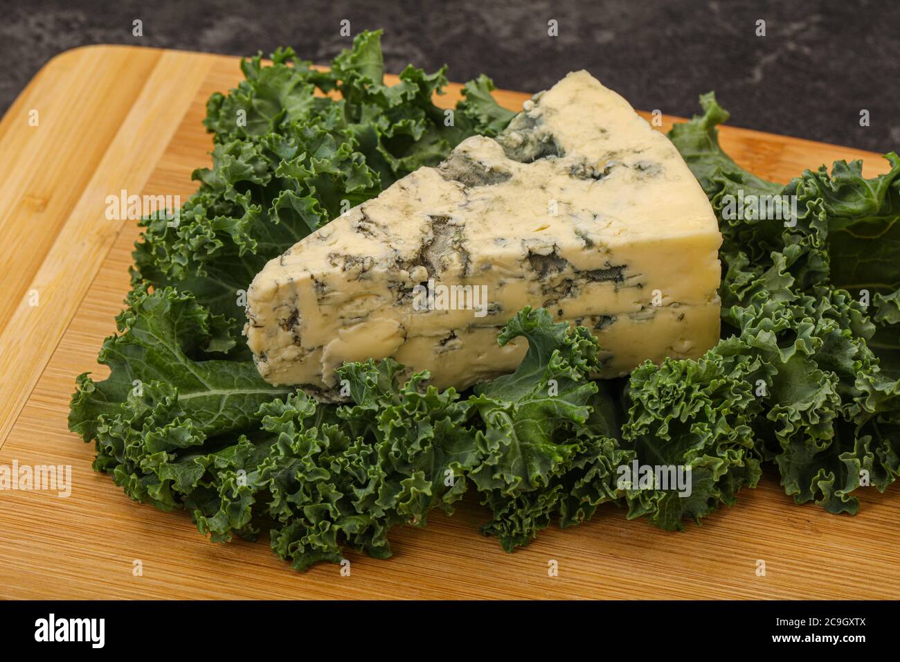 Dairy Blue cheese triangle with mold Stock Photo - Alamy