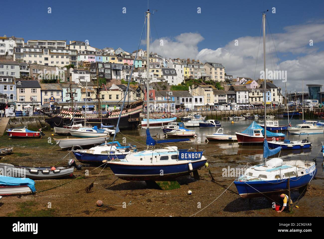 Brixham inner harbour at low tide, including the full-size replica of ...