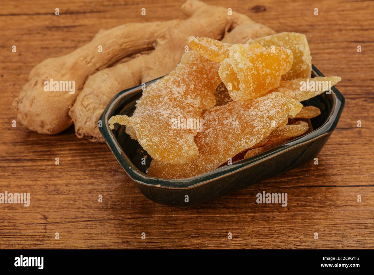 Dry sweet ginger snack in the bowl Stock Photo - Alamy