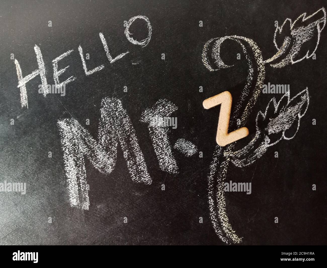 Hello mister Z text displayed on chalk board concept with wooden ...