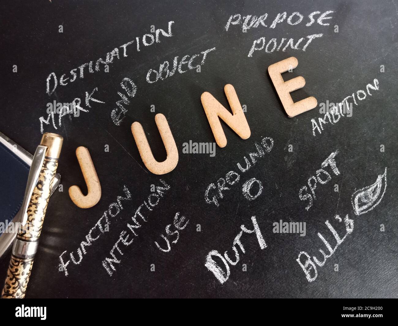 June word presented with multiple business related terminology on black ...