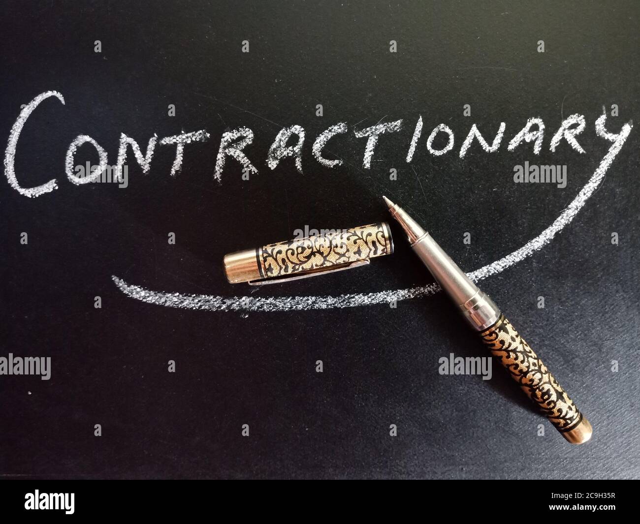 Contractionary word presented on chalkboard with school educational ...