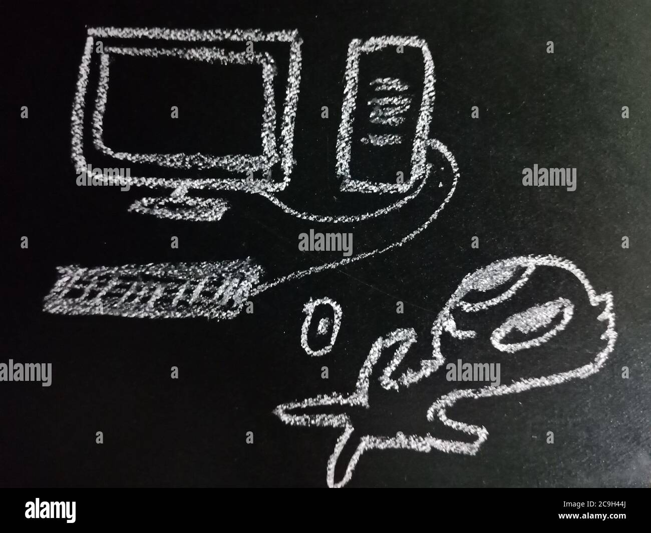 Desk top computer with user cartoon art drawing on chalkboard for kid ...