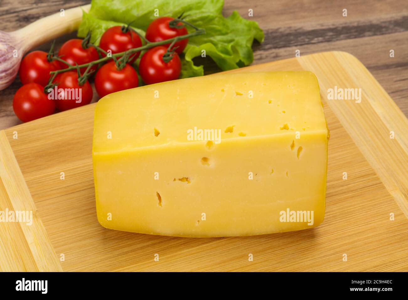 Swiss Hard yellow tasty cheese brick Stock Photo - Alamy