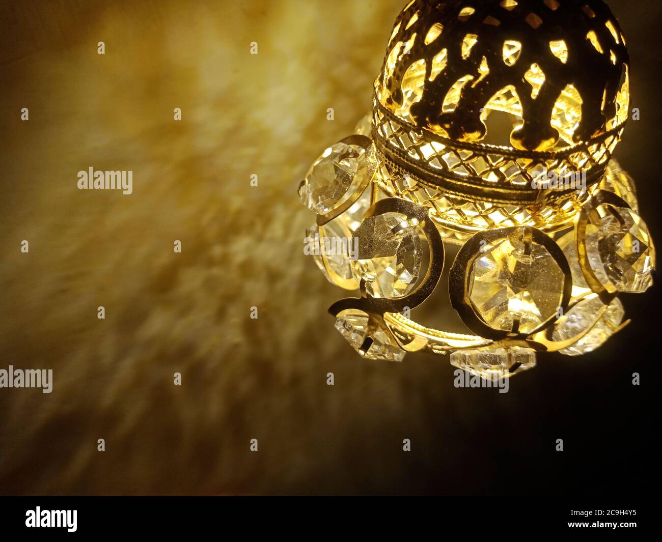 Golden night lamp background with diamond light reflecting patten ...
