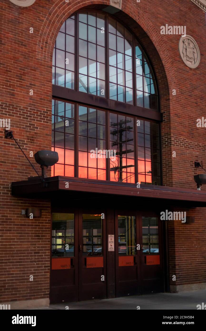 Detroit, Michigan - Sunset reflection in the windows of Eastern Market ...