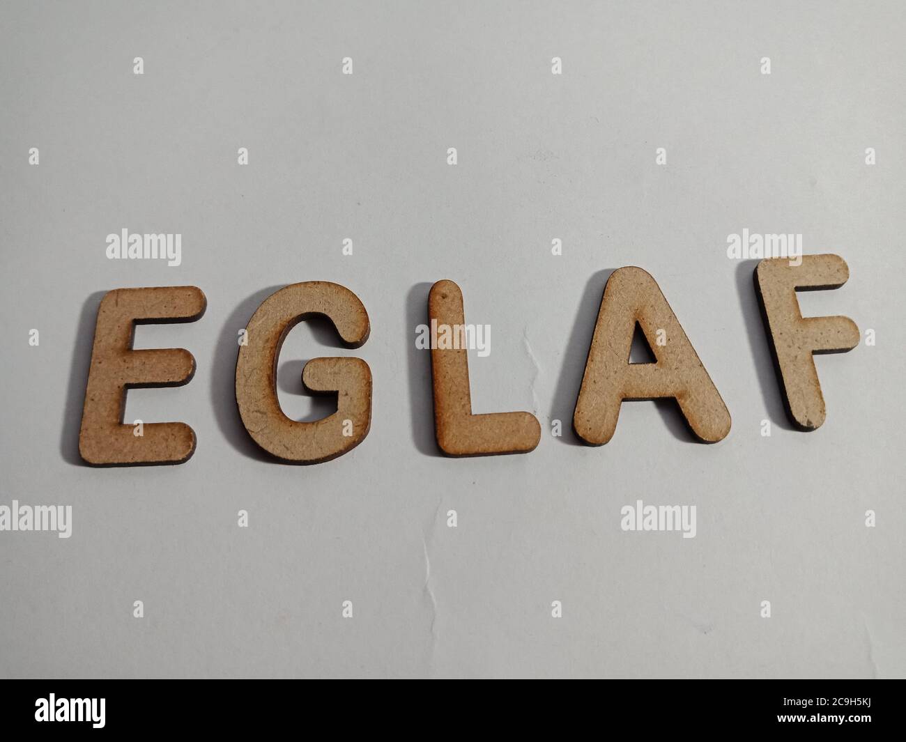 Eglaf latest vocabulary presented on white paper texture with wooden ...