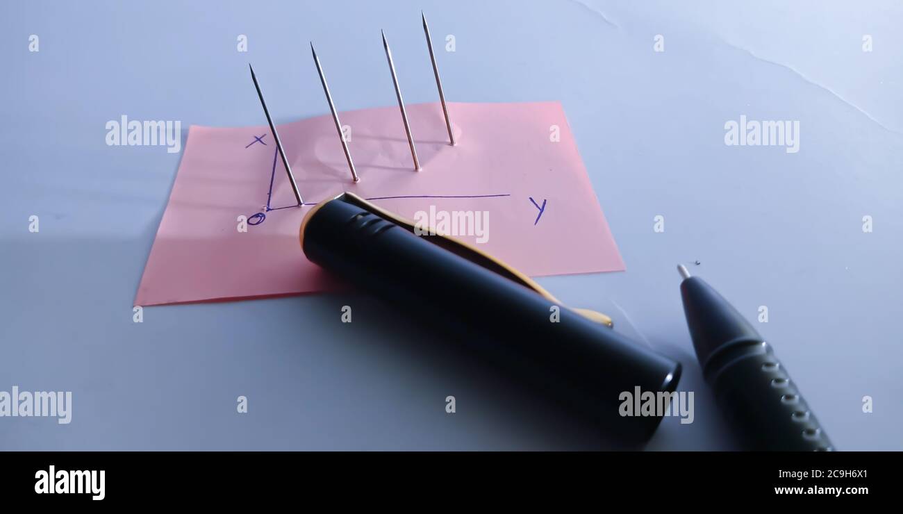 Paper slip with pin word with hand written concept on education pattern ...