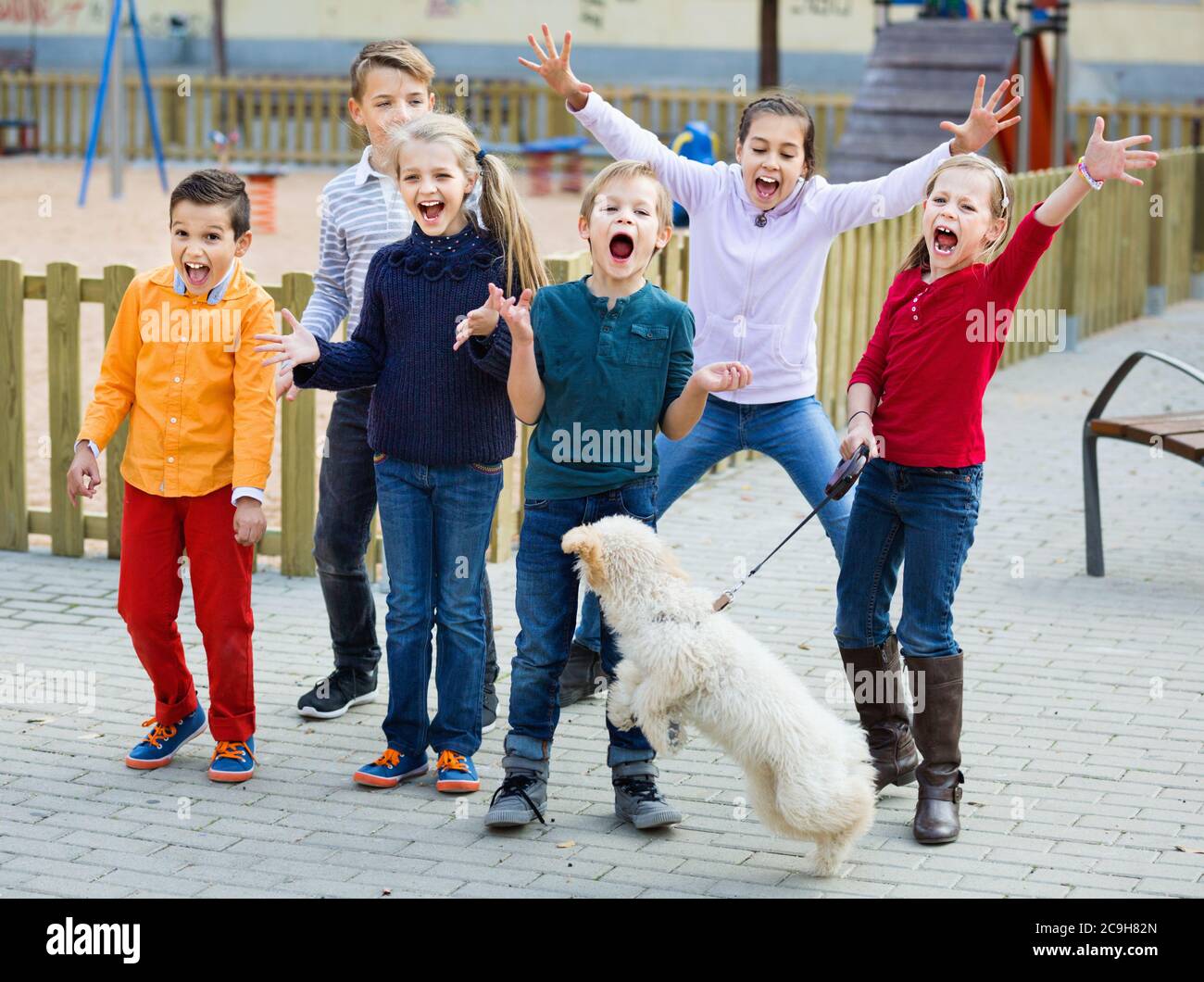 Cheerful positive kids having fun and jumping up Stock Photo - Alamy
