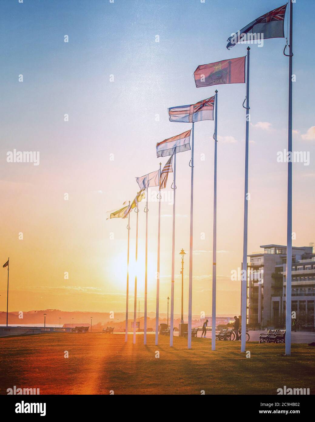Sunset on Plymouth Hoe with multiple flags. HDR photography was used ...