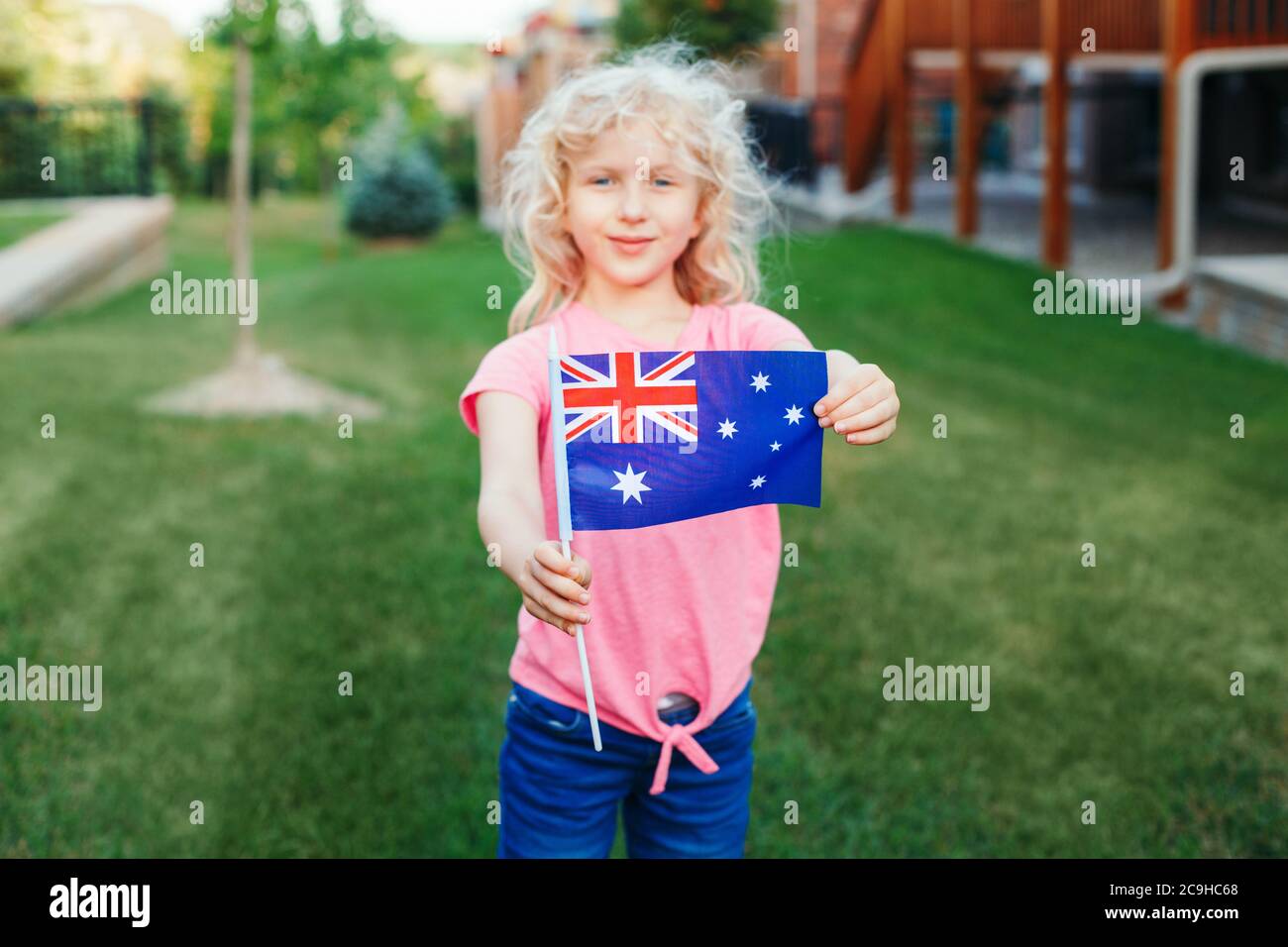 Adorable cute happy Caucasian girl holding Australian flag. Smiling ...