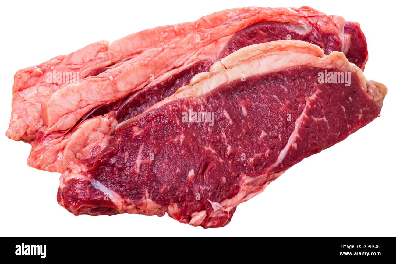Raw beef fillet with onion and pepper ready for cooking. Isolated over ...