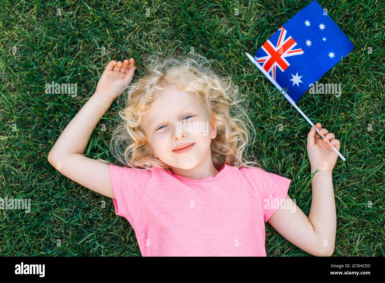 Adorable cute happy Caucasian girl holding Australian flag. Smiling ...