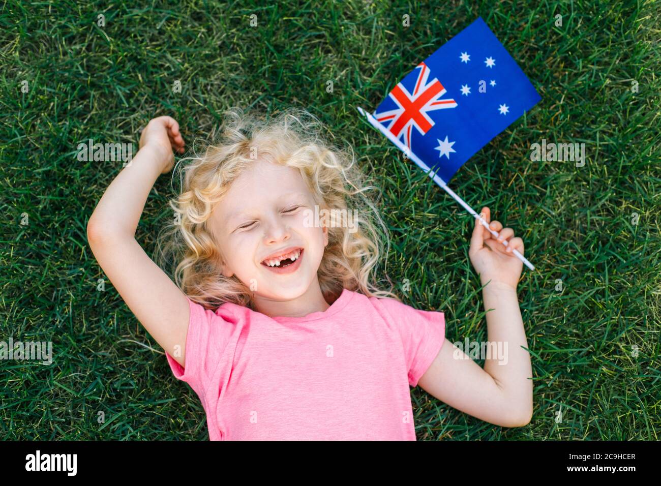 Adorable cute happy Caucasian girl holding Australian flag. Smiling ...