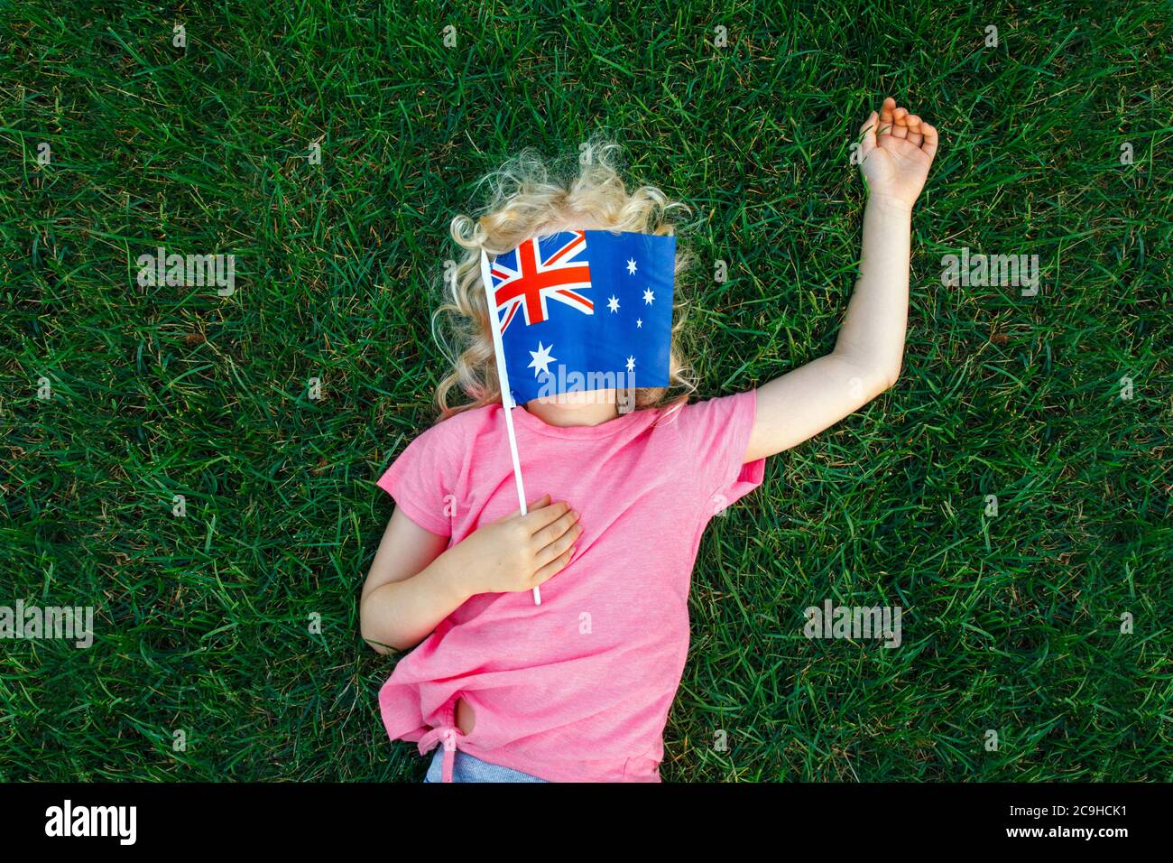 Adorable cute happy Caucasian girl holding Australian flag. Funny child ...