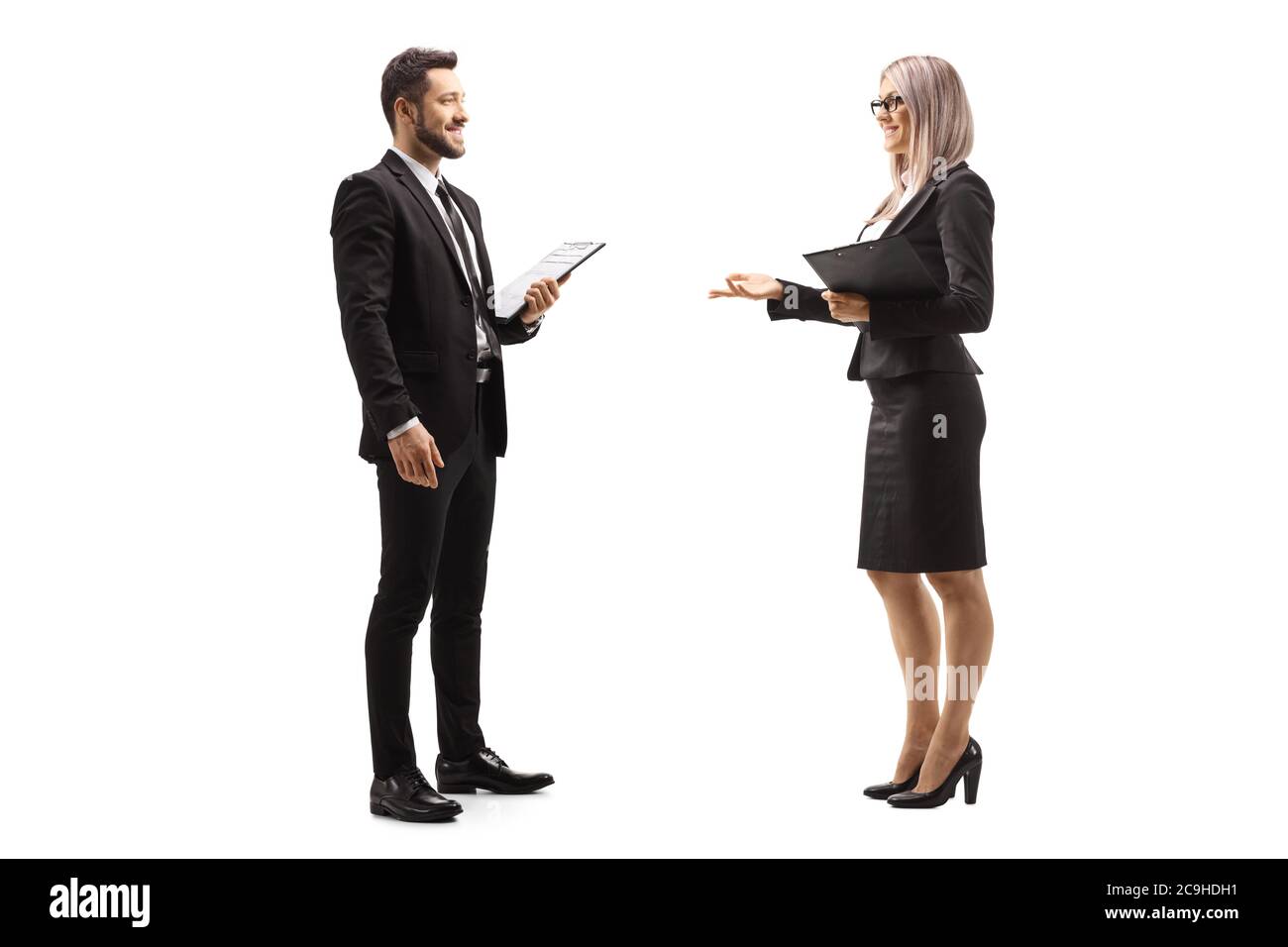 Full length profile shot of a businessman and businesswoman having a ...