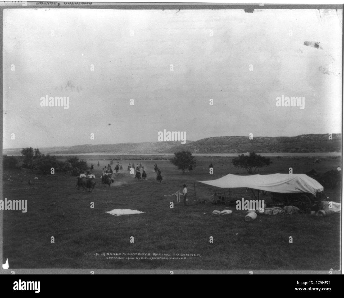 JA Ranch cowboys racing to dinner Stock Photo - Alamy