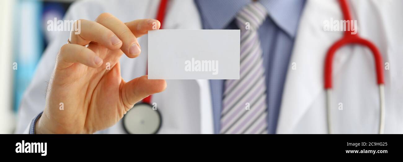 Male medicine doctor hand holding blank calling card Stock Photo - Alamy