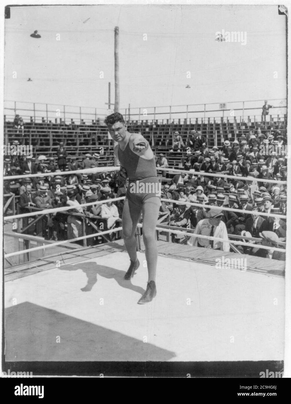 Jack Dempsey at his training camp, June 1921- shadow-boxing in ring ...