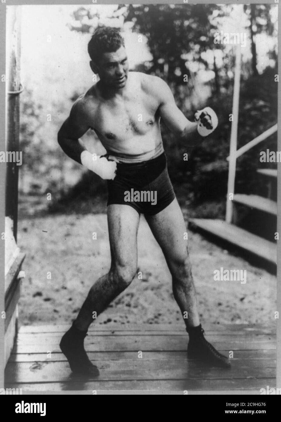 Jack Dempsey, full-length portrait, standing, facing right, training at ...