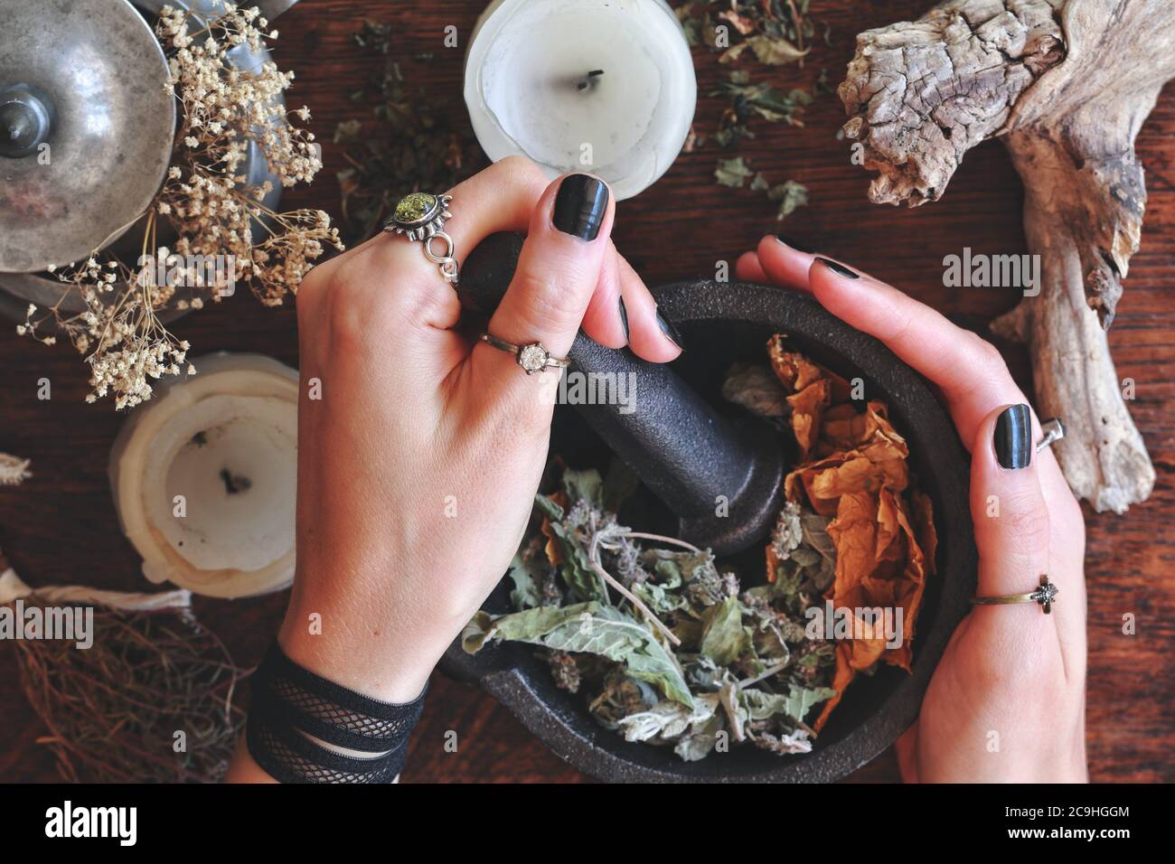 Kitchen witchery - female wiccan witch holding pestle and mortar in her ...