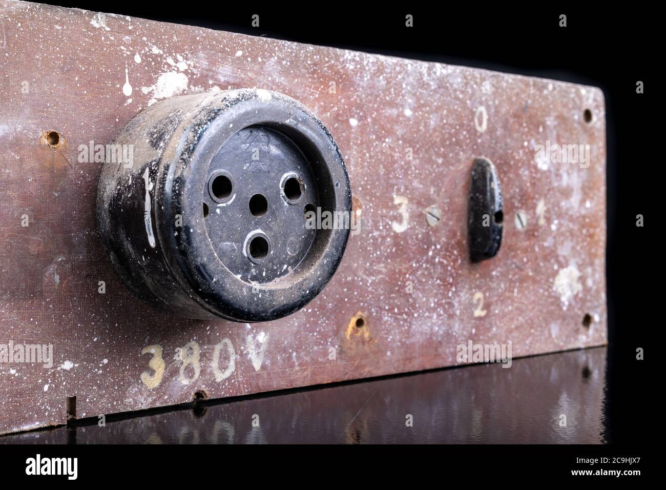 Old high voltage electric socket. Electric board with a controller ...