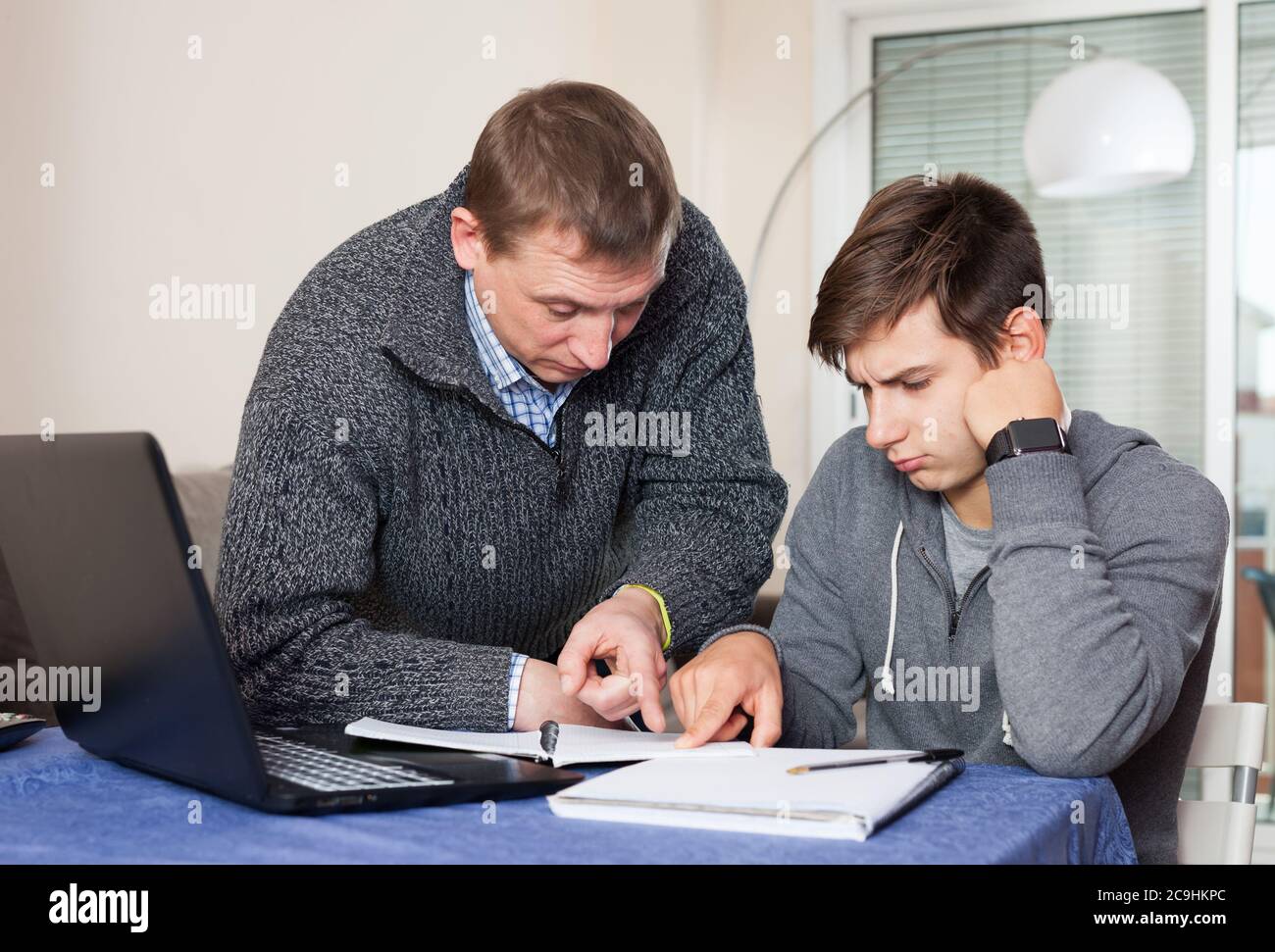 Father scolds son for poor grades in school Stock Photo - Alamy