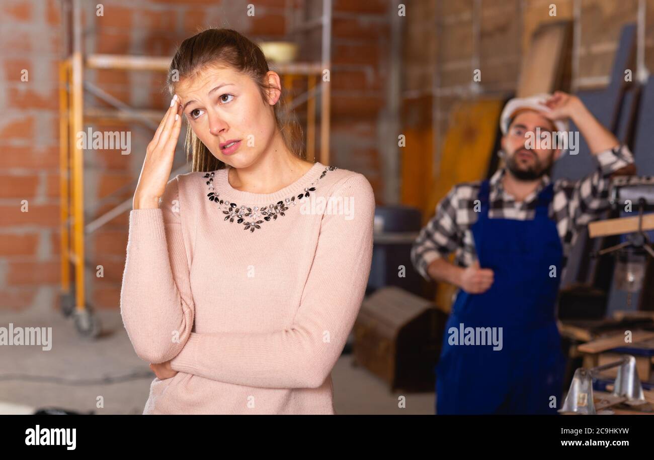 Customer upset with the work of the builder Stock Photo - Alamy